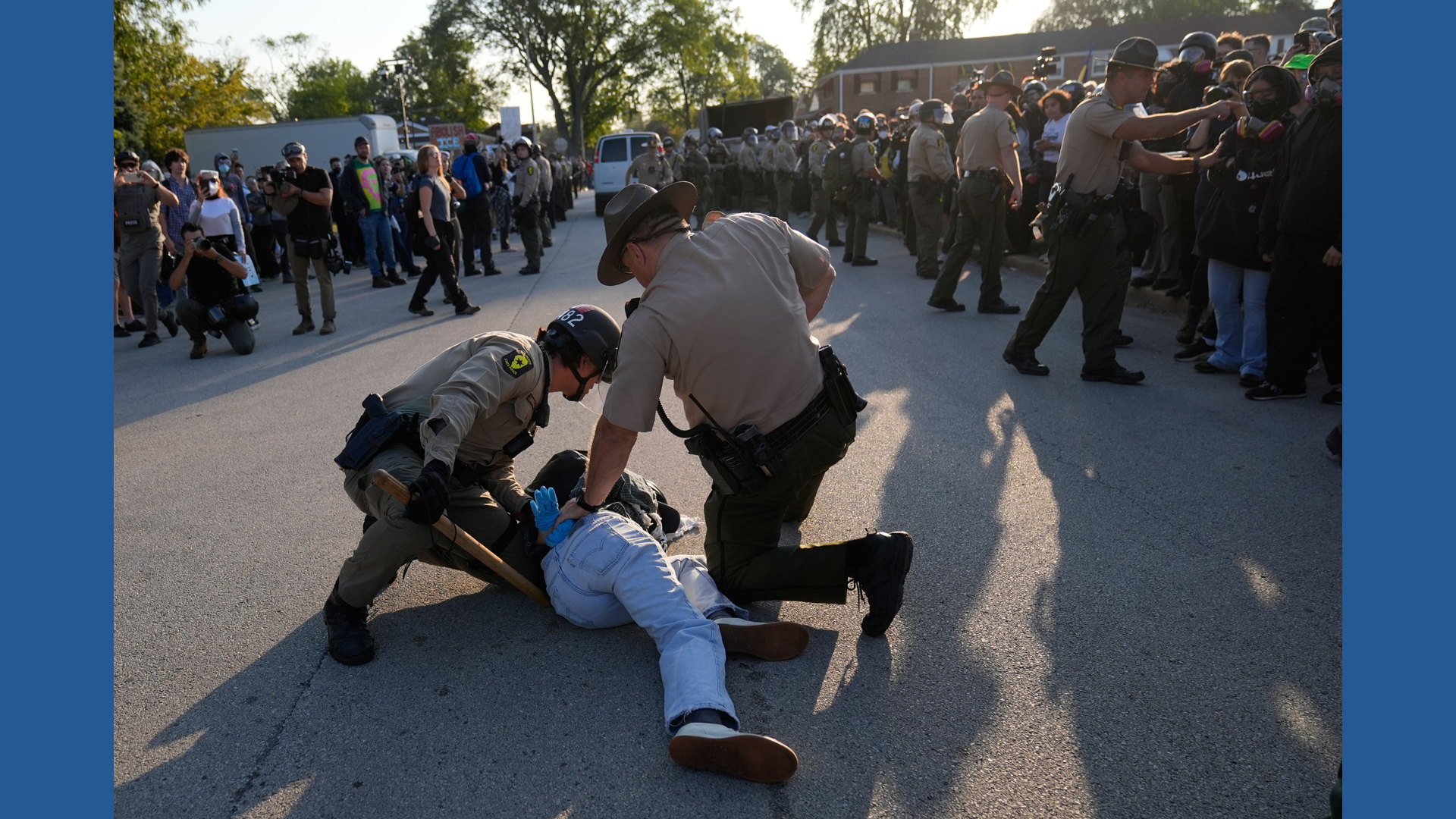 Noem visits Chicago area ICE facility as agents arrest 13, raid city ...