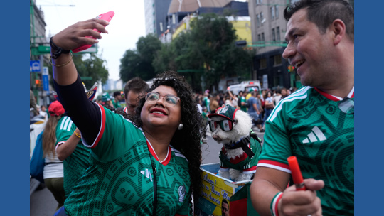 Rescue dog Osito steals hearts at the World Cup, one bike ride at a ...