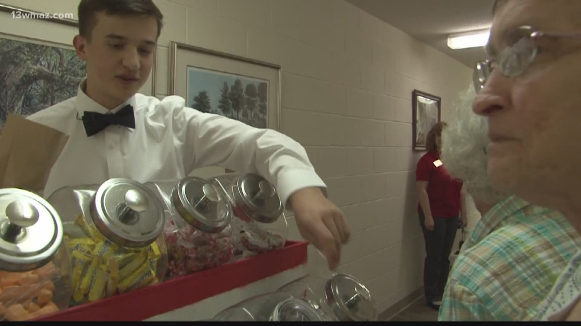Two teens pass out candy at a nursing center | 13wmaz.com